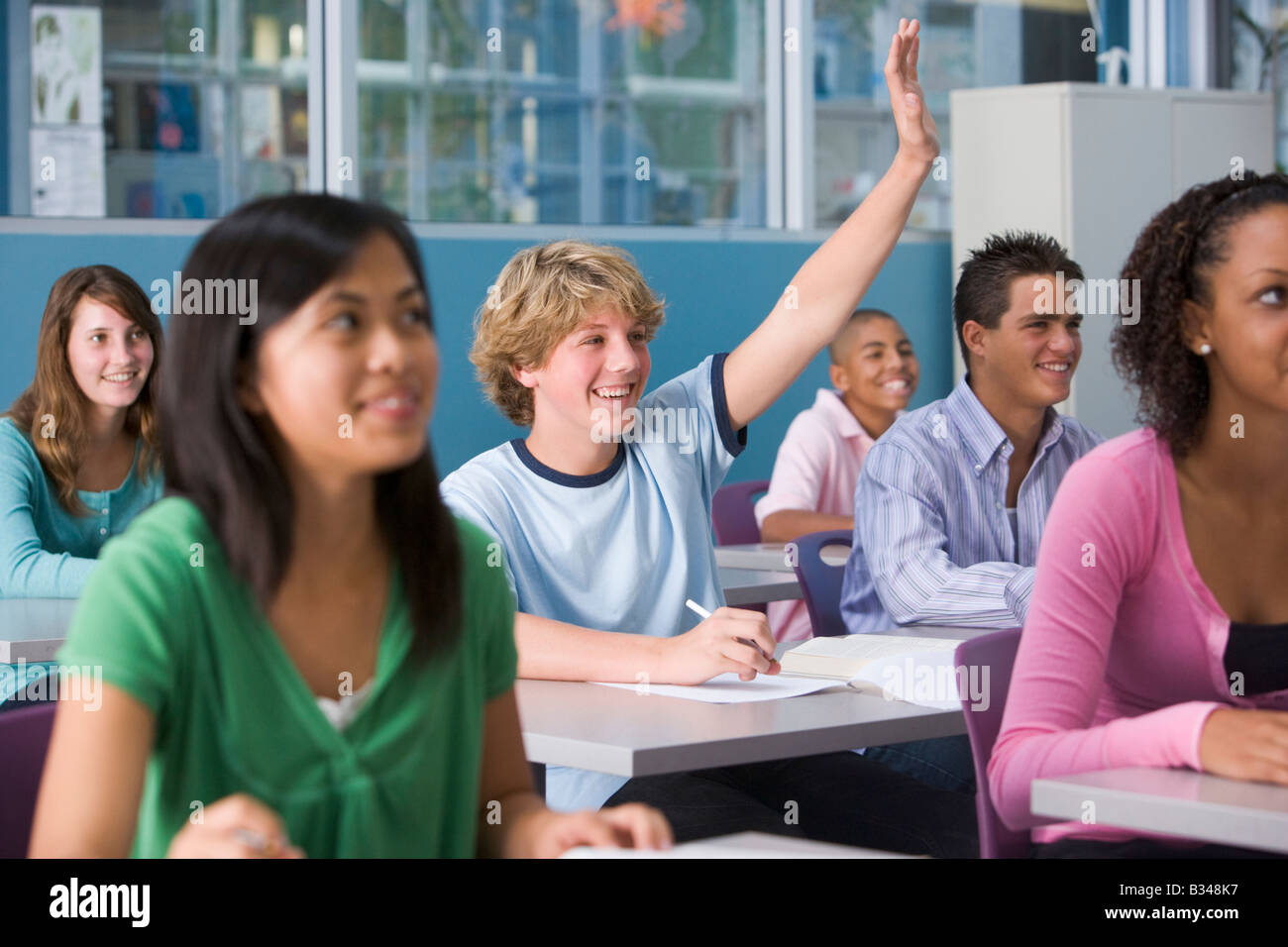 Students answering questions in geography class Stock Photo - Alamy
