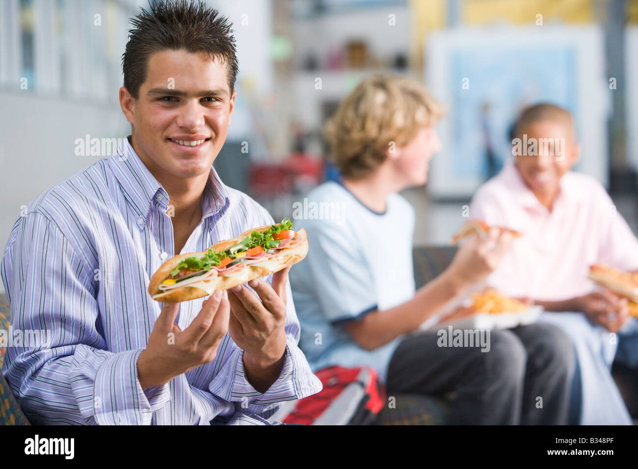 Students having lunch Stock Photo - Alamy