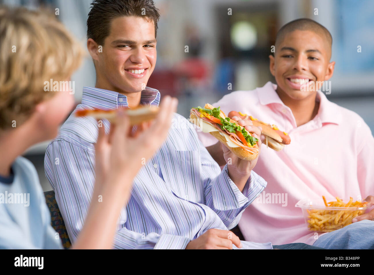 Students having lunch Stock Photo - Alamy