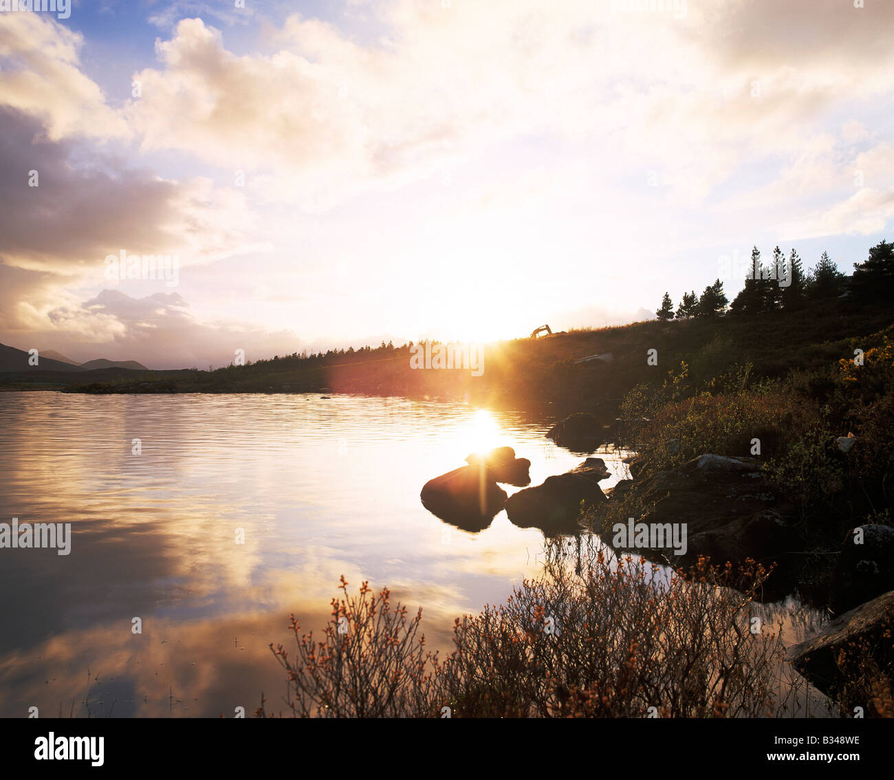 Dawn dusk reflected on a calm irish lake hi-res stock photography and ...