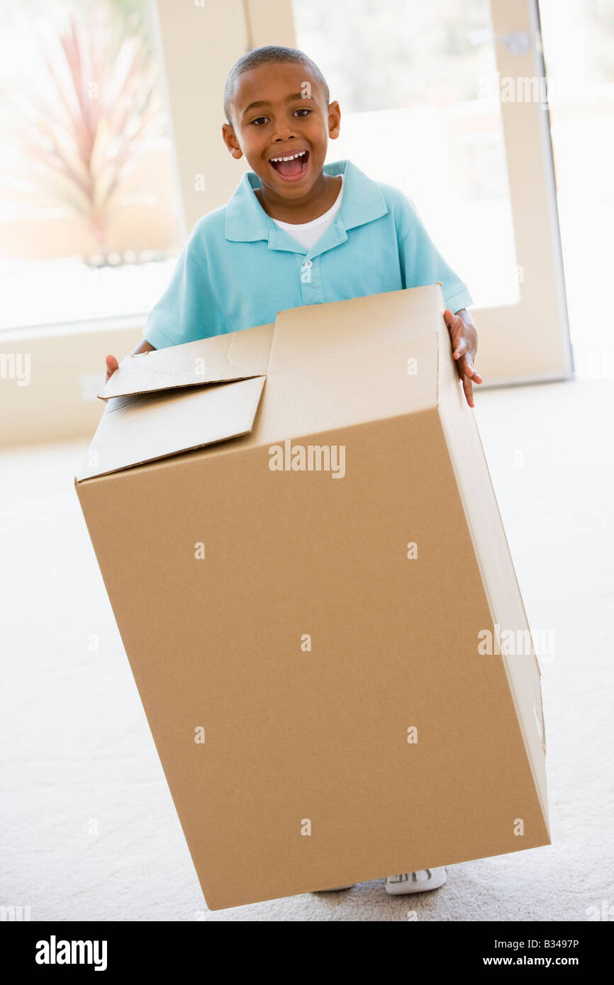 Struggle to carry boxes hi-res stock photography and images - Alamy