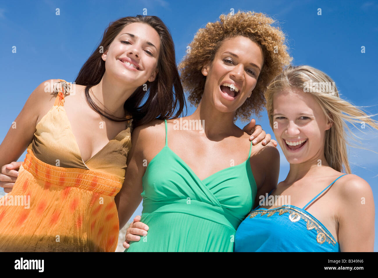 Three women posing outdoors Stock Photo - Alamy