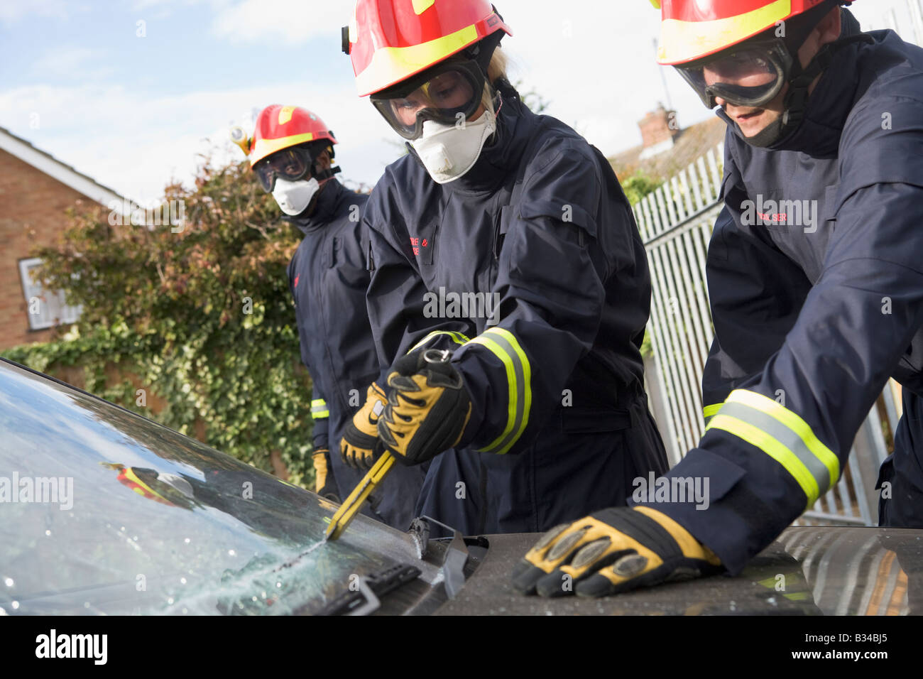 Firefighter cutting out windshield hi-res stock photography and images ...