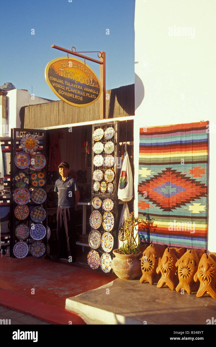 Boy standing in front of a Mexican handicrafts shop in the Spanish ...