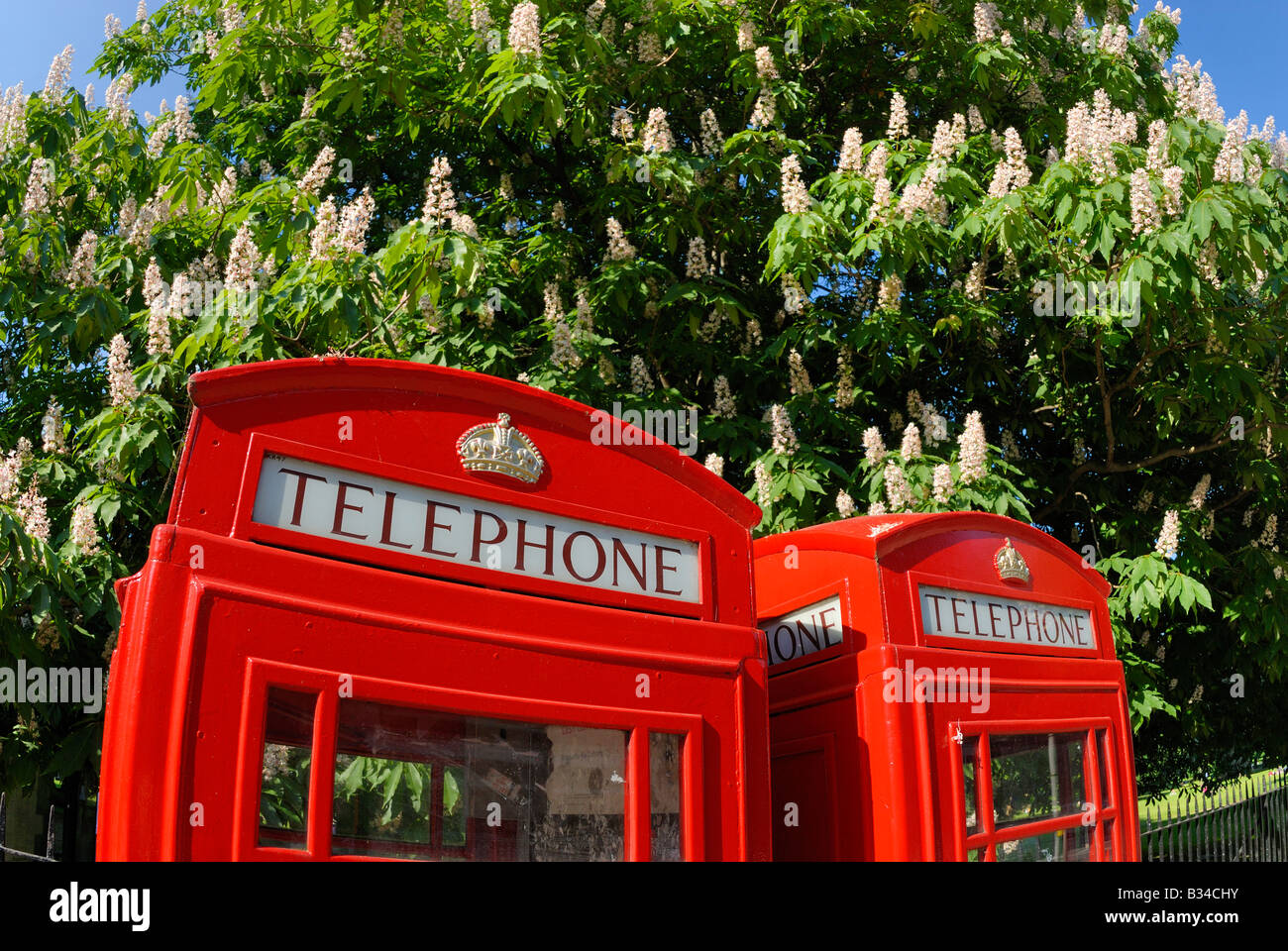 2 red telephone boxes with crown hi-res stock photography and images ...