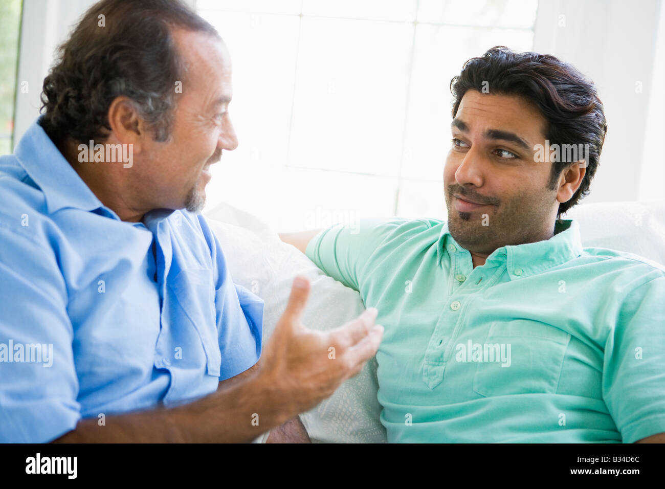Two Men Chatting Sofa High Resolution Stock Photography and Images - Alamy