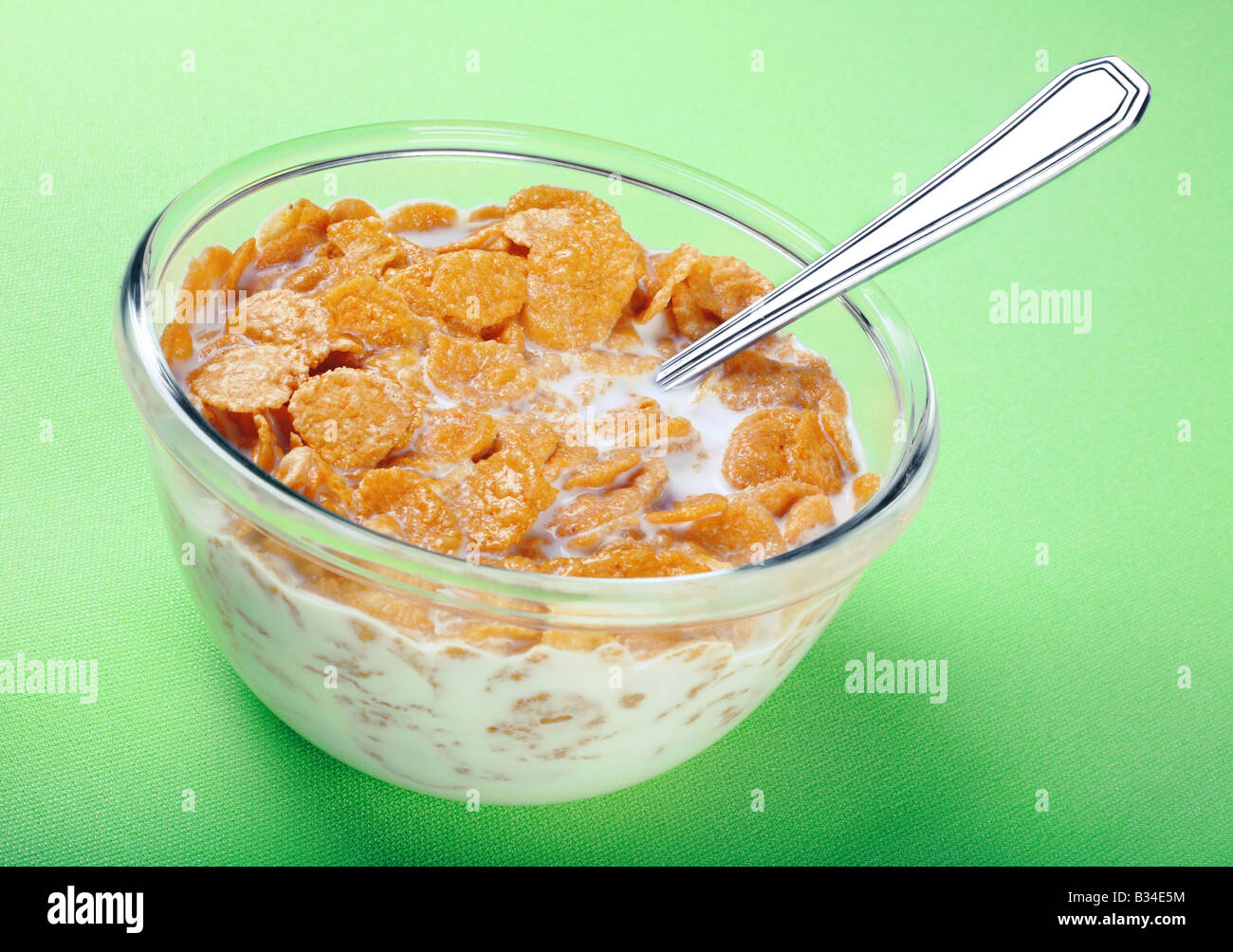 Flake corn with milk on white background Stock Photo - Alamy