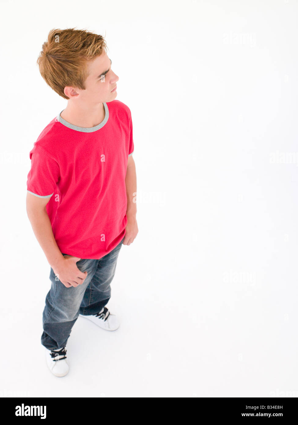 Teenage boy with hands in pockets Stock Photo - Alamy
