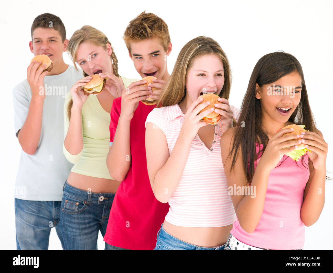 Child eating hamburger group hi-res stock photography and images - Alamy