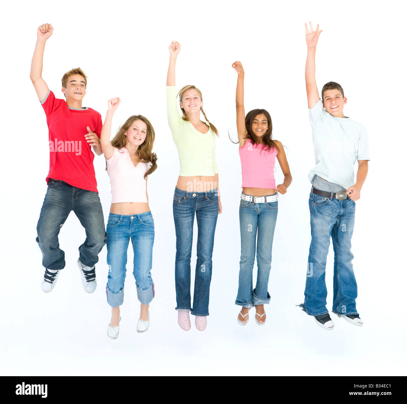 Five friends jumping and smiling Stock Photo - Alamy
