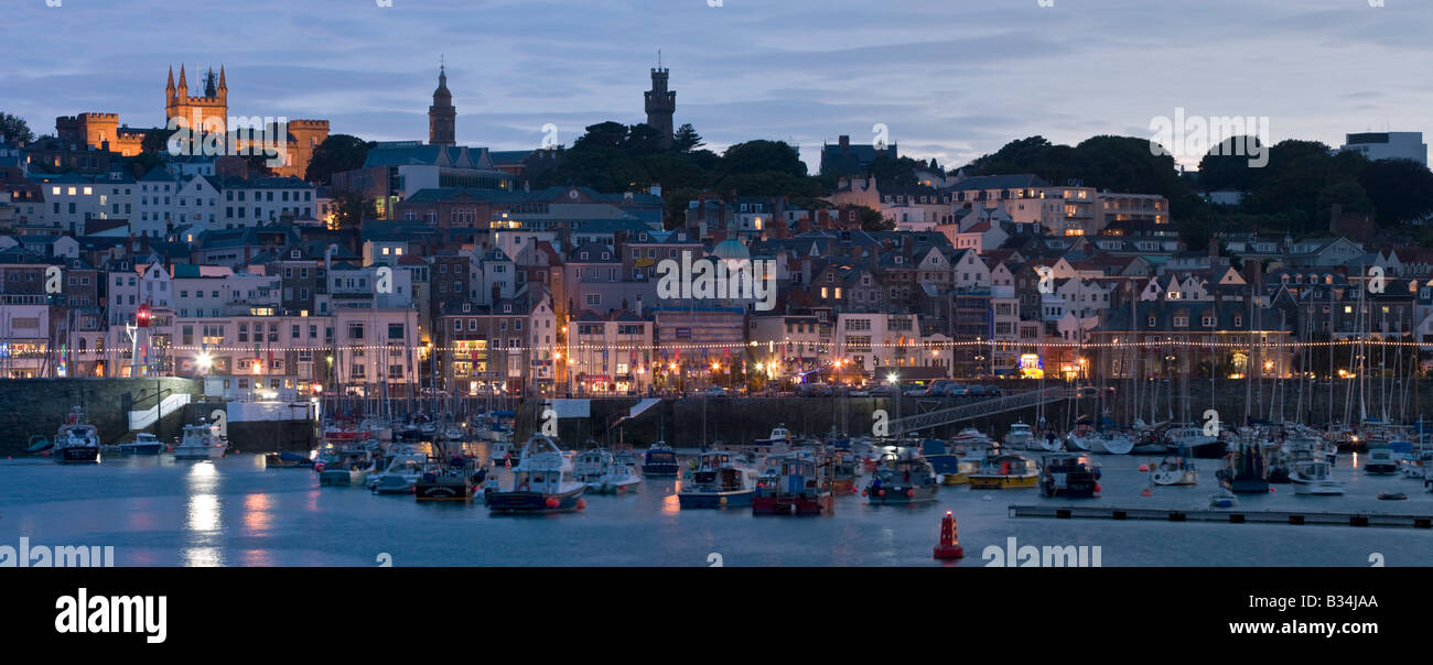 Panorama of St Peter Port in Guernsey at dusk Stock Photo - Alamy