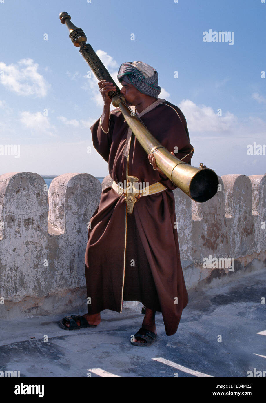 Kenya, Coast Province, Lamu Island. A Swahili man in traditional attire ...