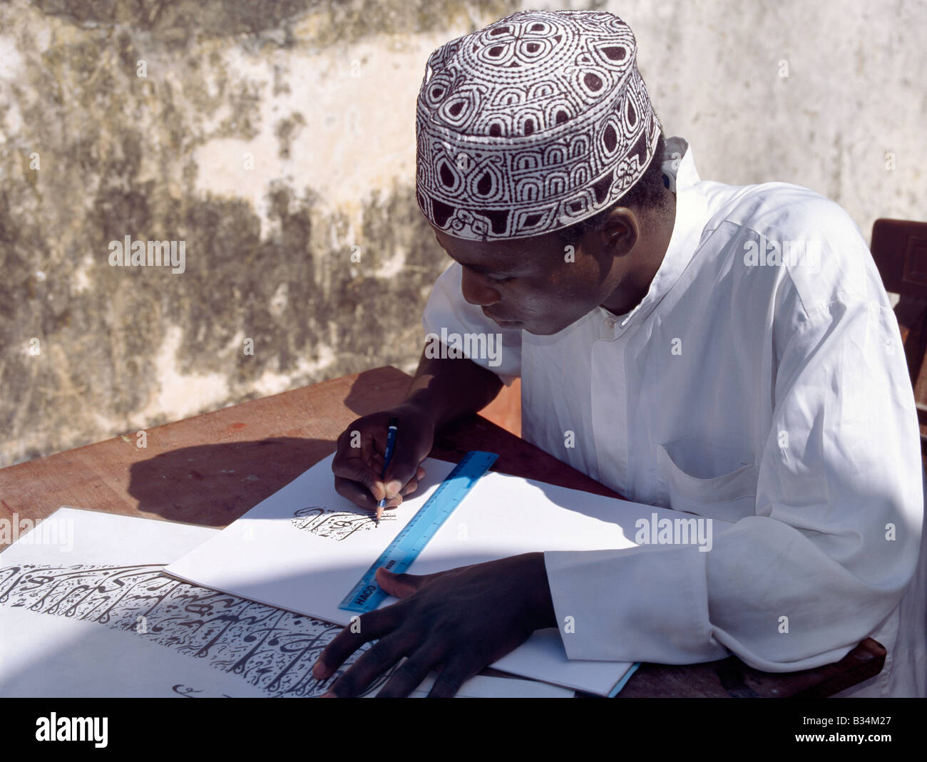 Kenya, Coast Province, Lamu Island. A Swahili student in Lamu practices ...