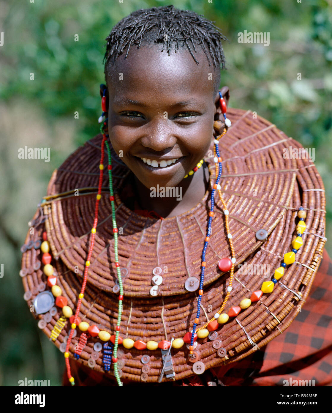 Kenya, Kabarnet District, Tangulbei. A young Pokot girl wears large ...