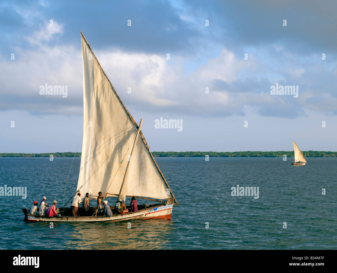 Kenya, Kisingitini, Pate Island. At sunrise, fishing boats set sail ...