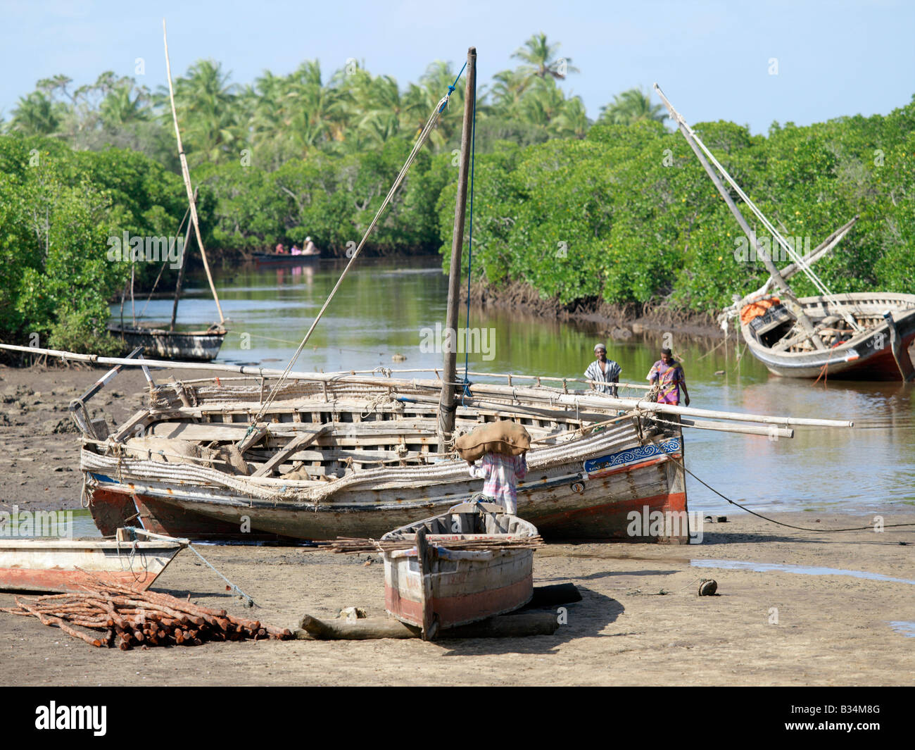 Kenya, Pate Island, Siyu. Wooden sailing boats anchor at the end of the ...