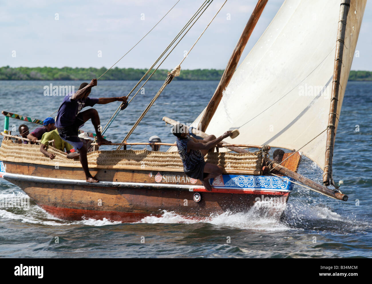 Kenya, Coast Province, Lamu Island. Dhows sailing off Lamu Island. Dhow ...