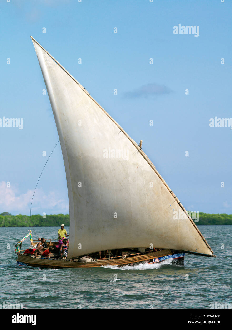 Kenya, Coast Province, Lamu Island. A Dhow sailing off Lamu Island ...