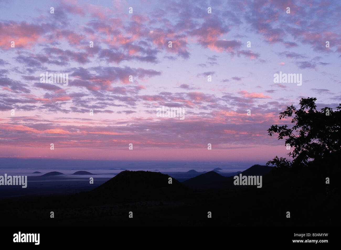 Kenya, Kibwezi, Chyulu Hills. At daybreak, cone-shaped hills ...