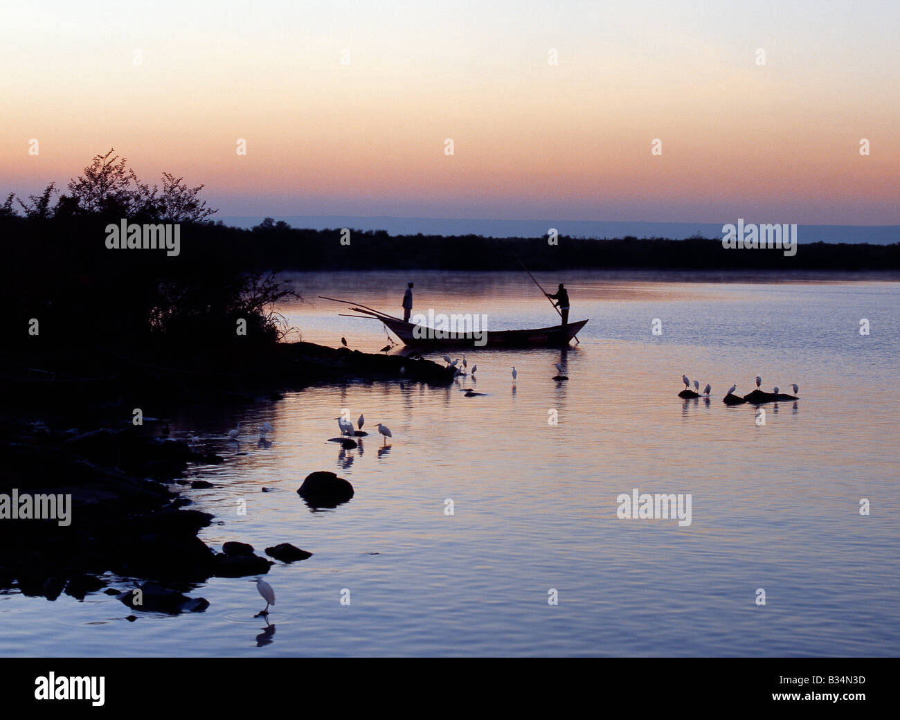 Kenya, Nyanza Province, Kisumu. At daybreak, fishermen leave Dunga ...