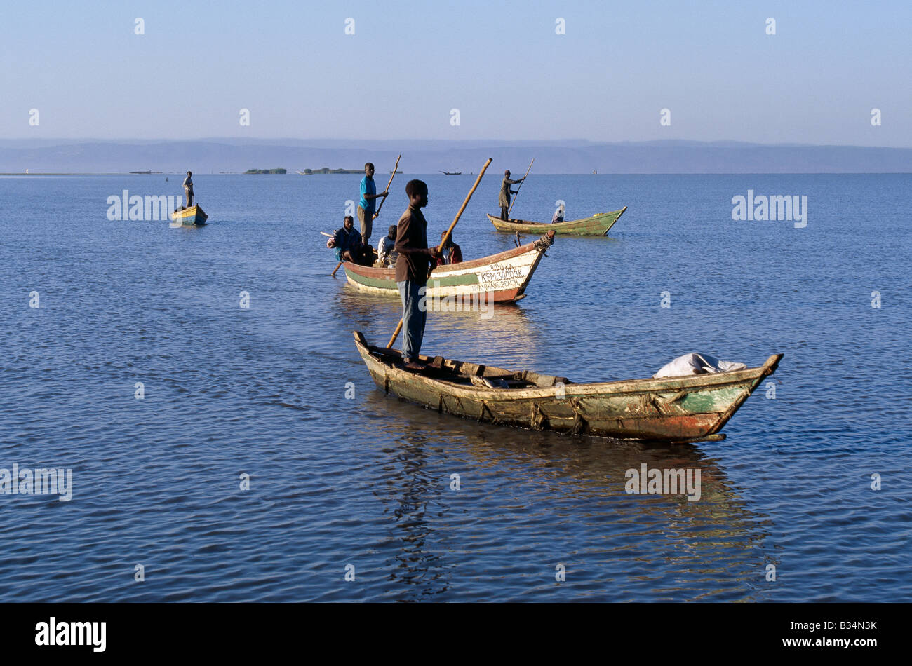 Kenya, Nyanza Province, Kisumu. Fishermen return to Dunga Beach soon ...