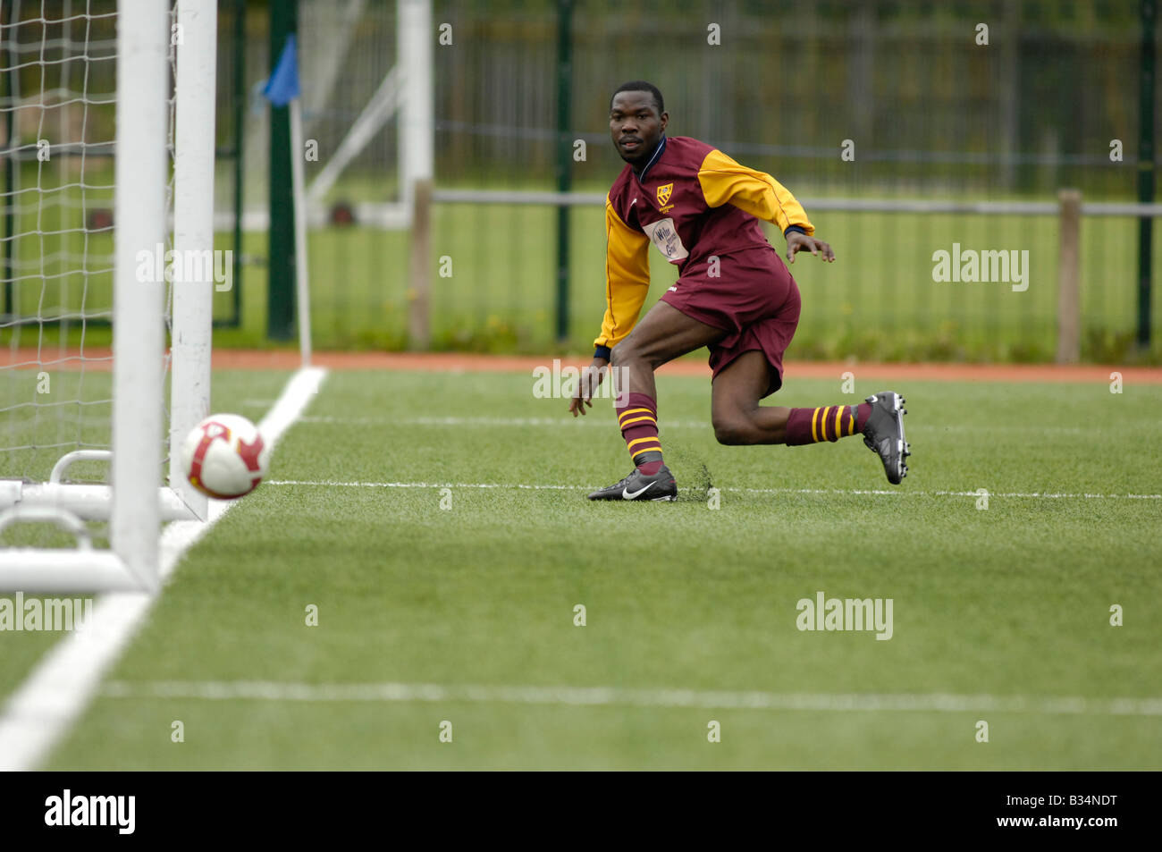 footballer scoring a goal Stock Photo - Alamy