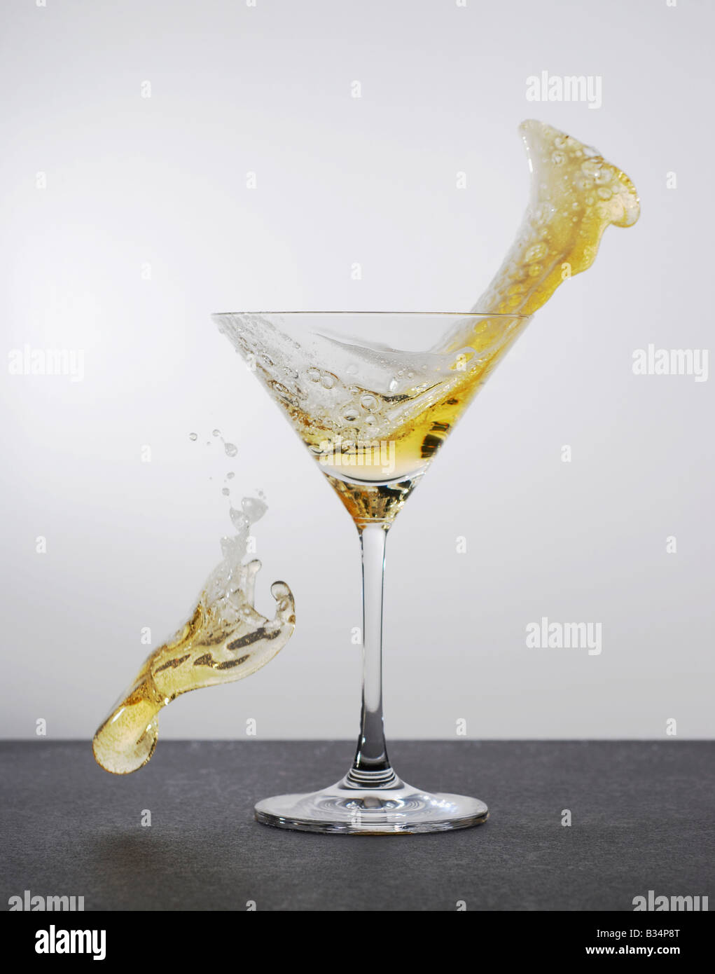 High-speed cocktail glass splash Stock Photo - Alamy