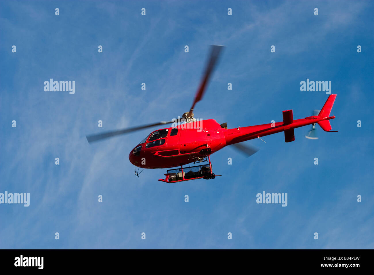 Red helicopter in the sky Stock Photo - Alamy