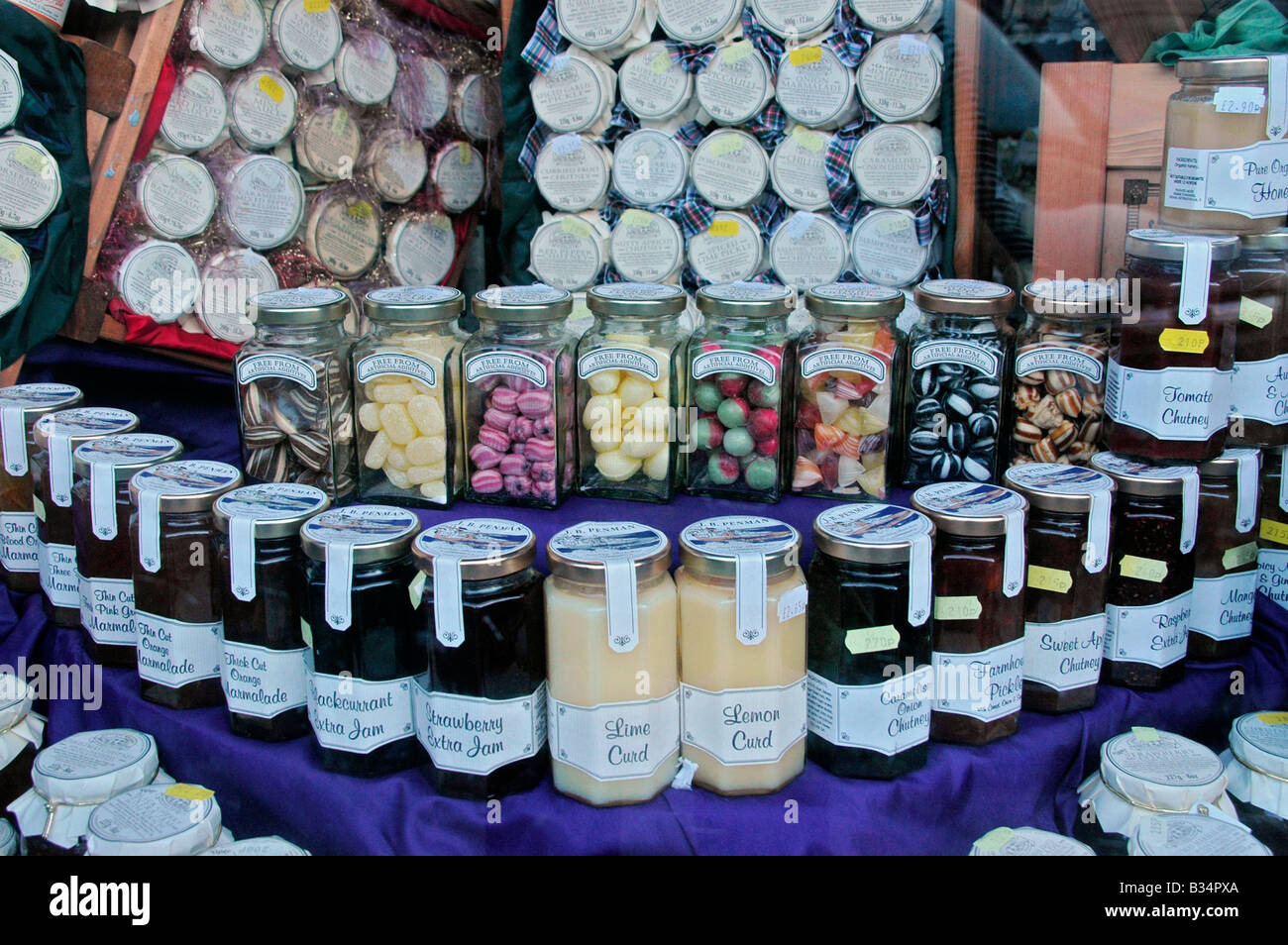 A display of jars of jams and pickles in a shop window Stock Photo - Alamy
