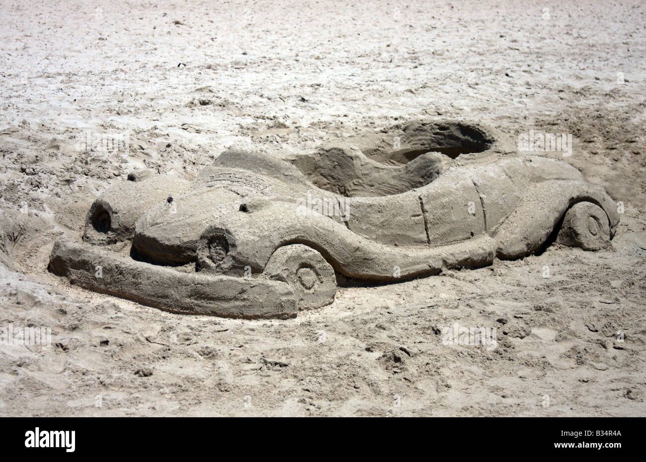 Car made from sand on a beach Stock Photo - Alamy