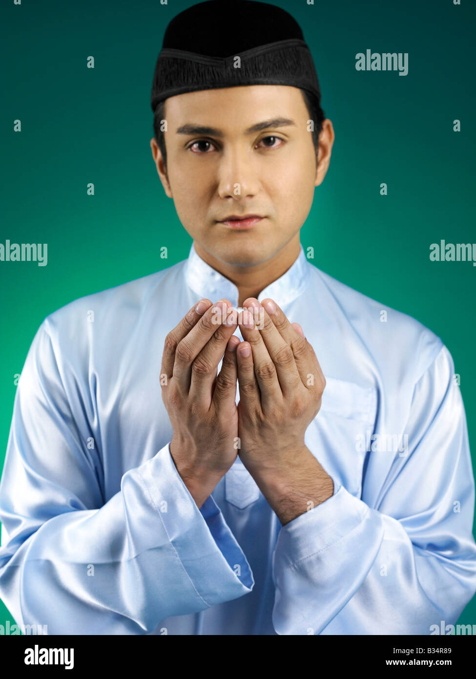 Portrait of man praying Stock Photo - Alamy