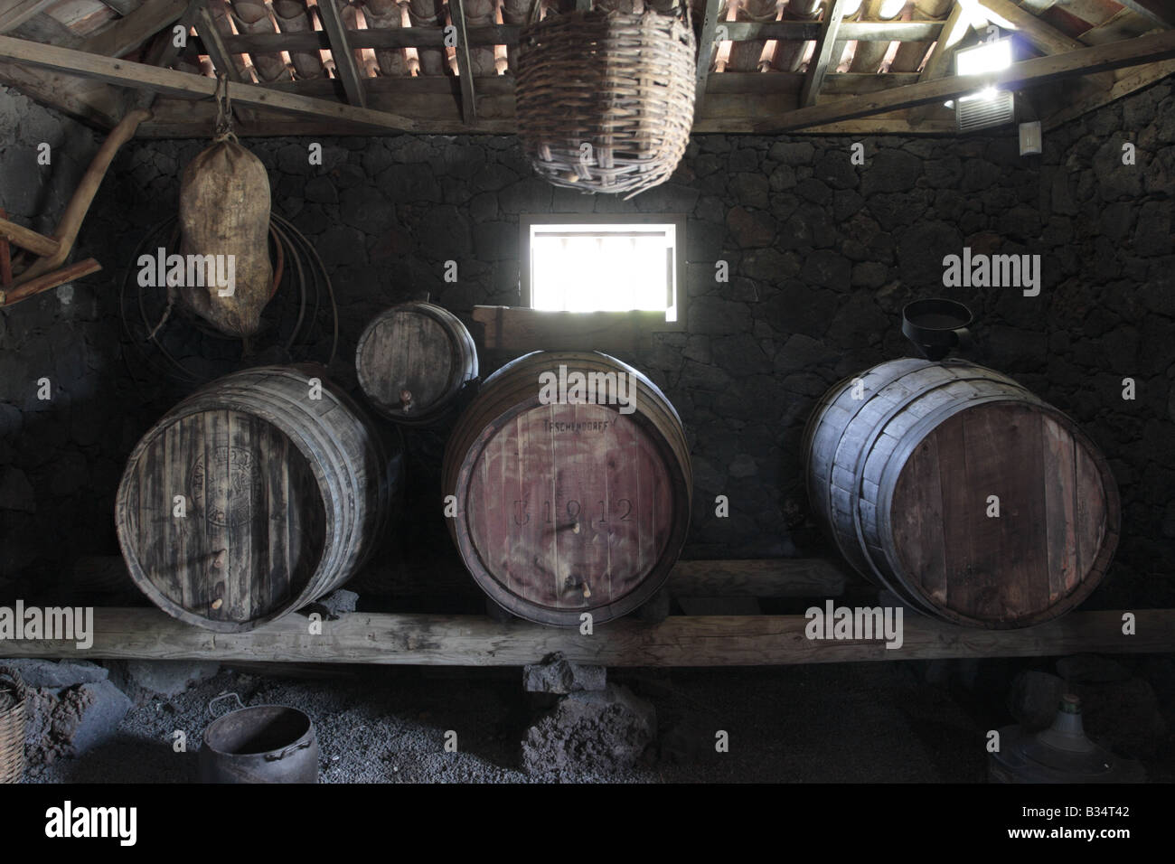 Old barrels on a rack at the wine Musuem in Las Manchas, La Palma ...