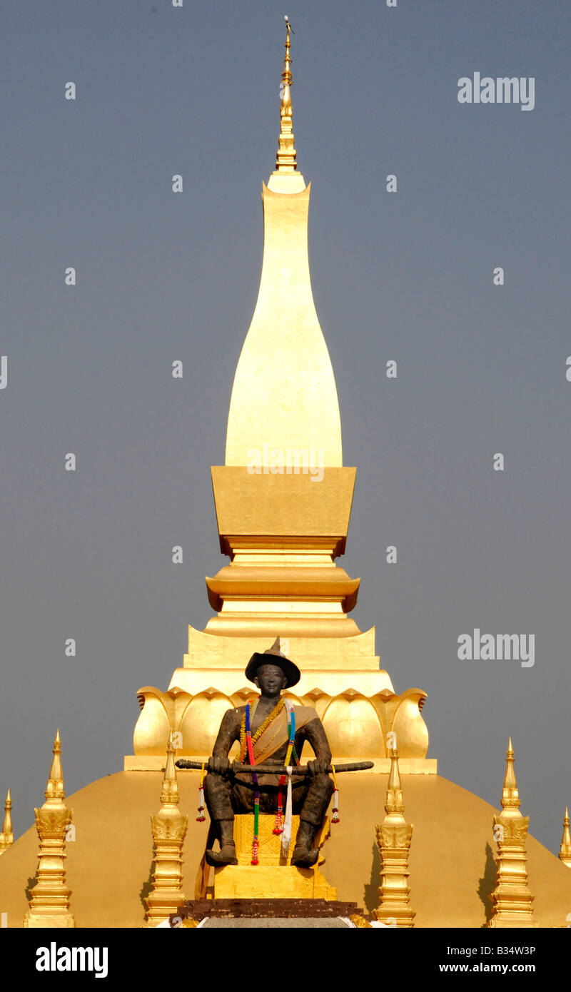 King Setthathirat statue in front of Pha That Luang Stupa Stock Photo ...
