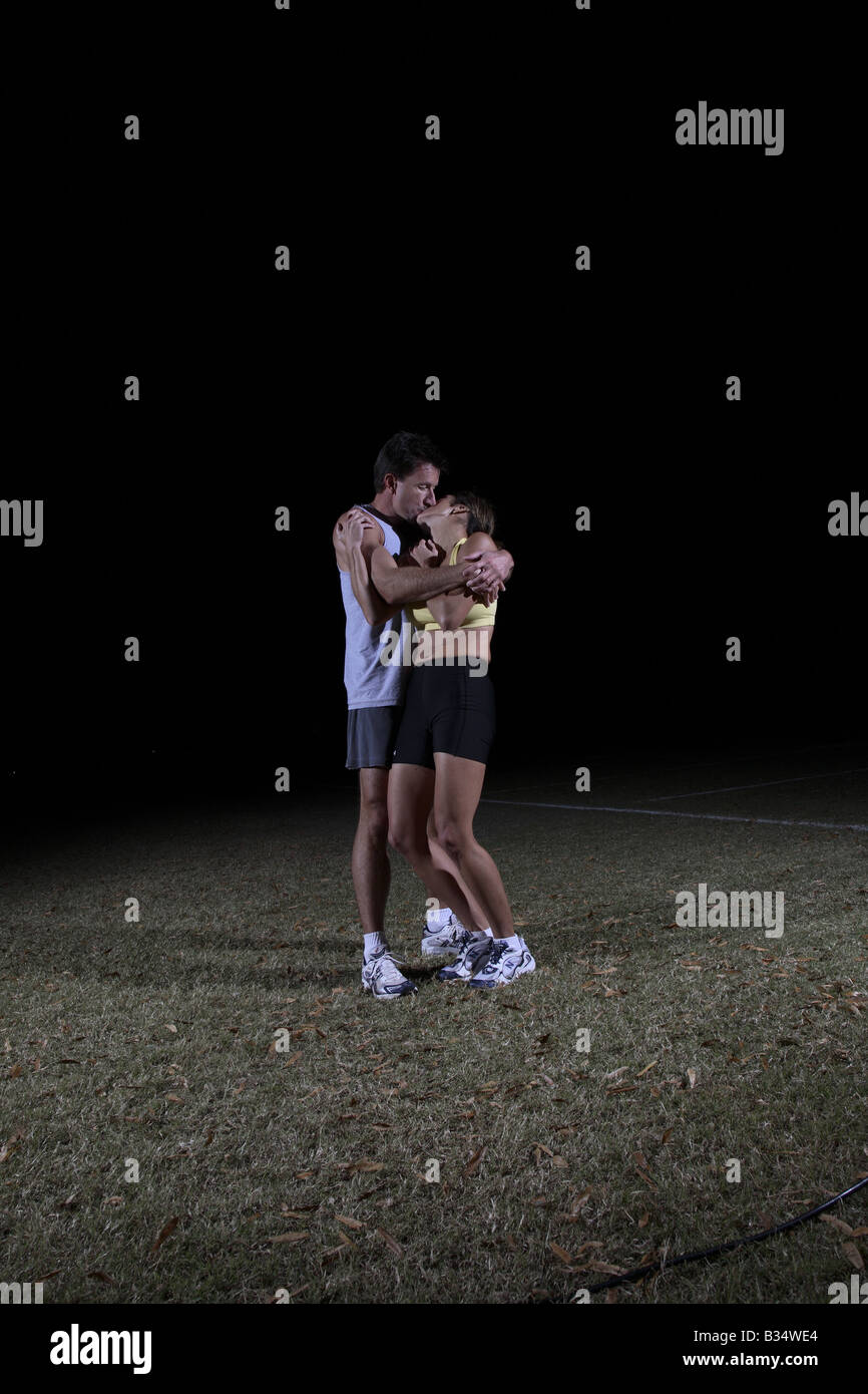 two athletes outdoors at night Stock Photo - Alamy