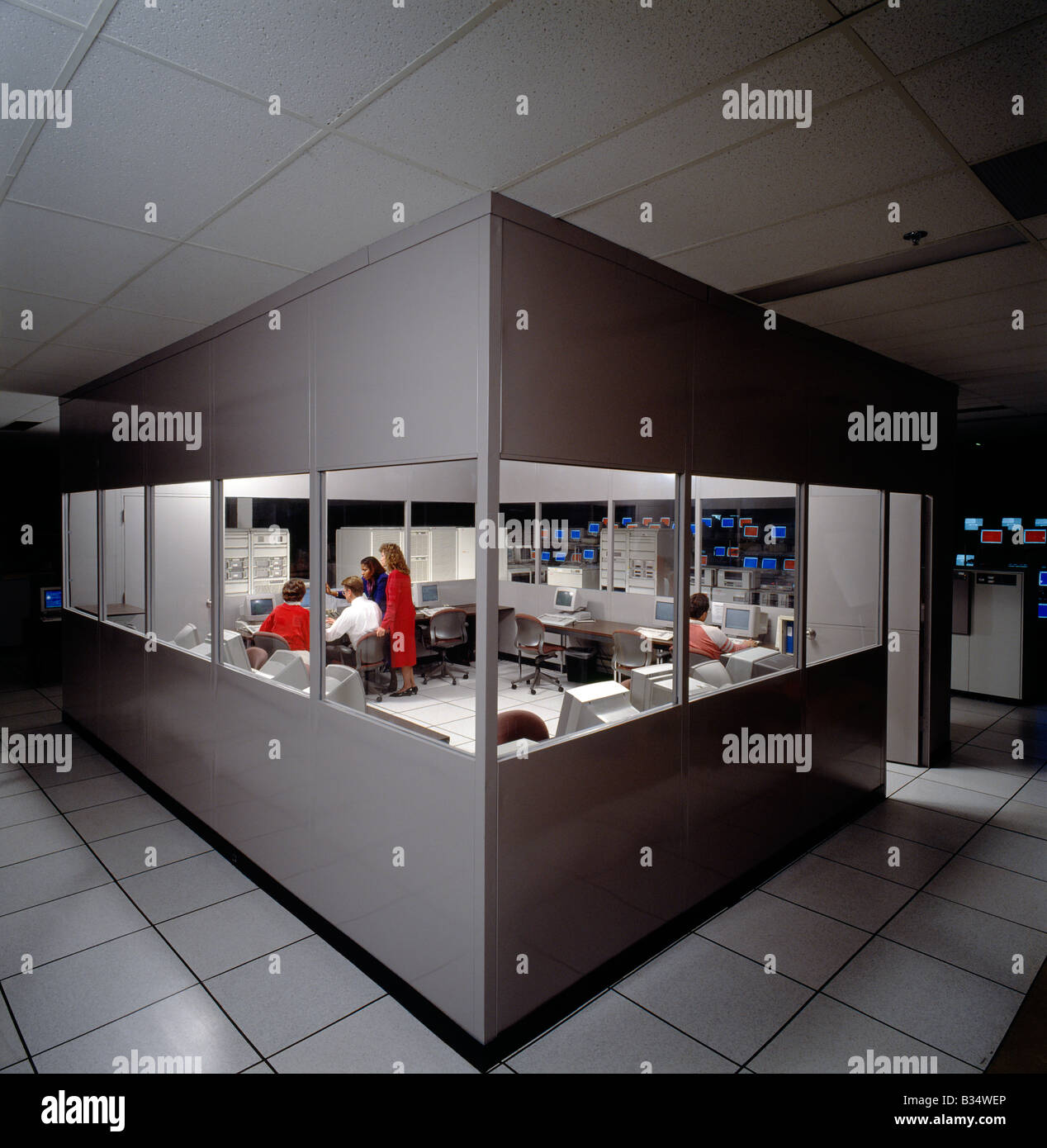 Workers in a laboratory used to test new computer equipment operability ...