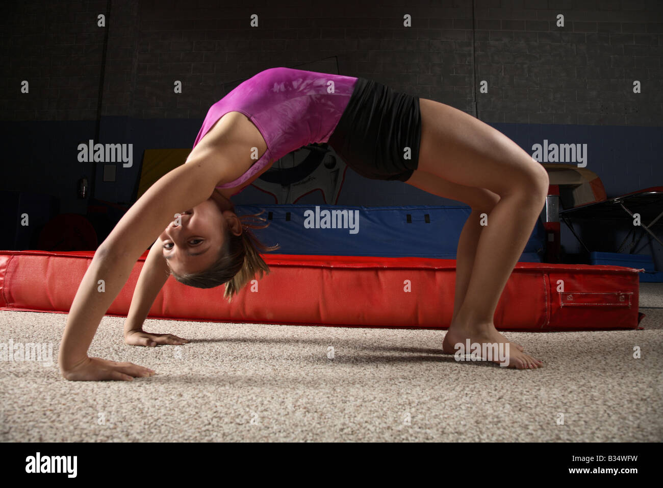 young female gymnast stretching Stock Photo - Alamy