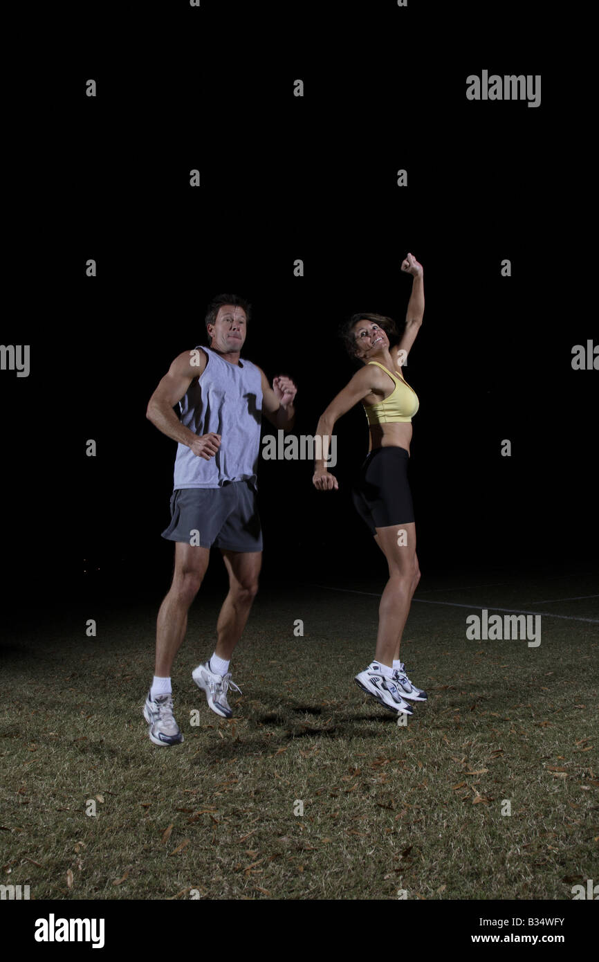 two athletes outdoors at night Stock Photo - Alamy
