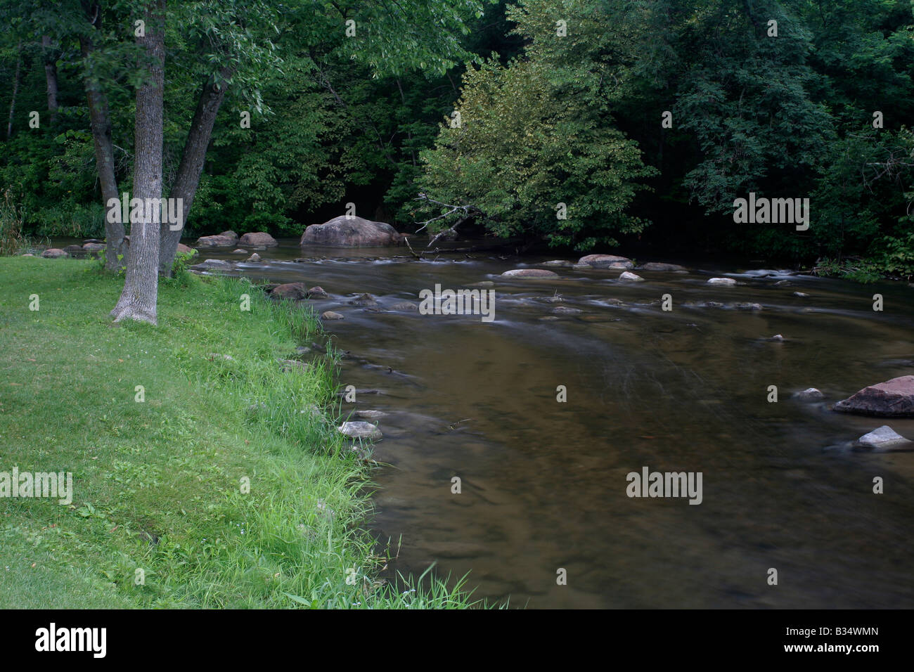 Stream through Brainard's Bridge park in Waupaca Wisconsin Stock Photo ...