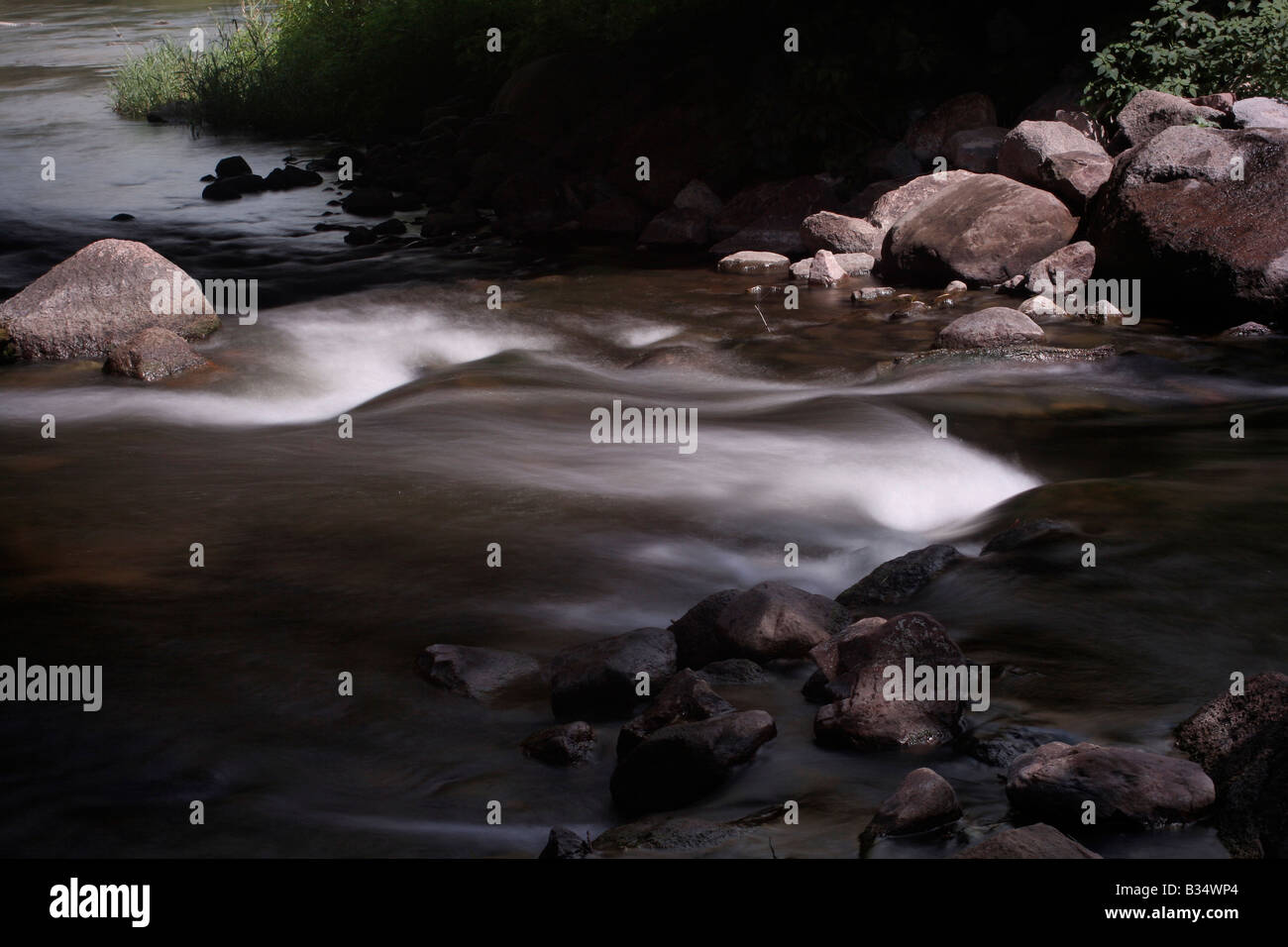 Stream flowing under bridge Brainard's Bridge park Waupaca Wisconsin ...