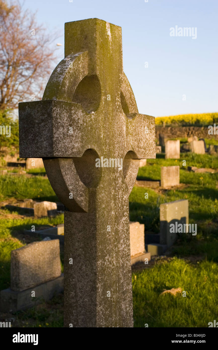 The celtic style cross of a gravestone in West Herrington cemetery in ...