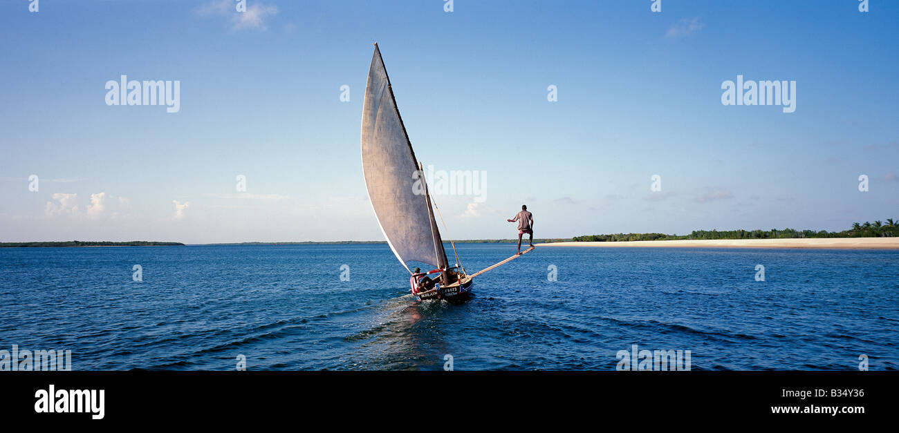 Kenya, Lamu Island, Lamu. A wooden sailing boat off Lamu Island. The ...