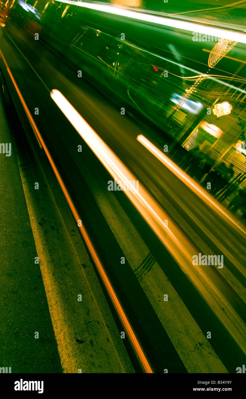 Blurred bus through zebra crossing green toned Stock Photo - Alamy