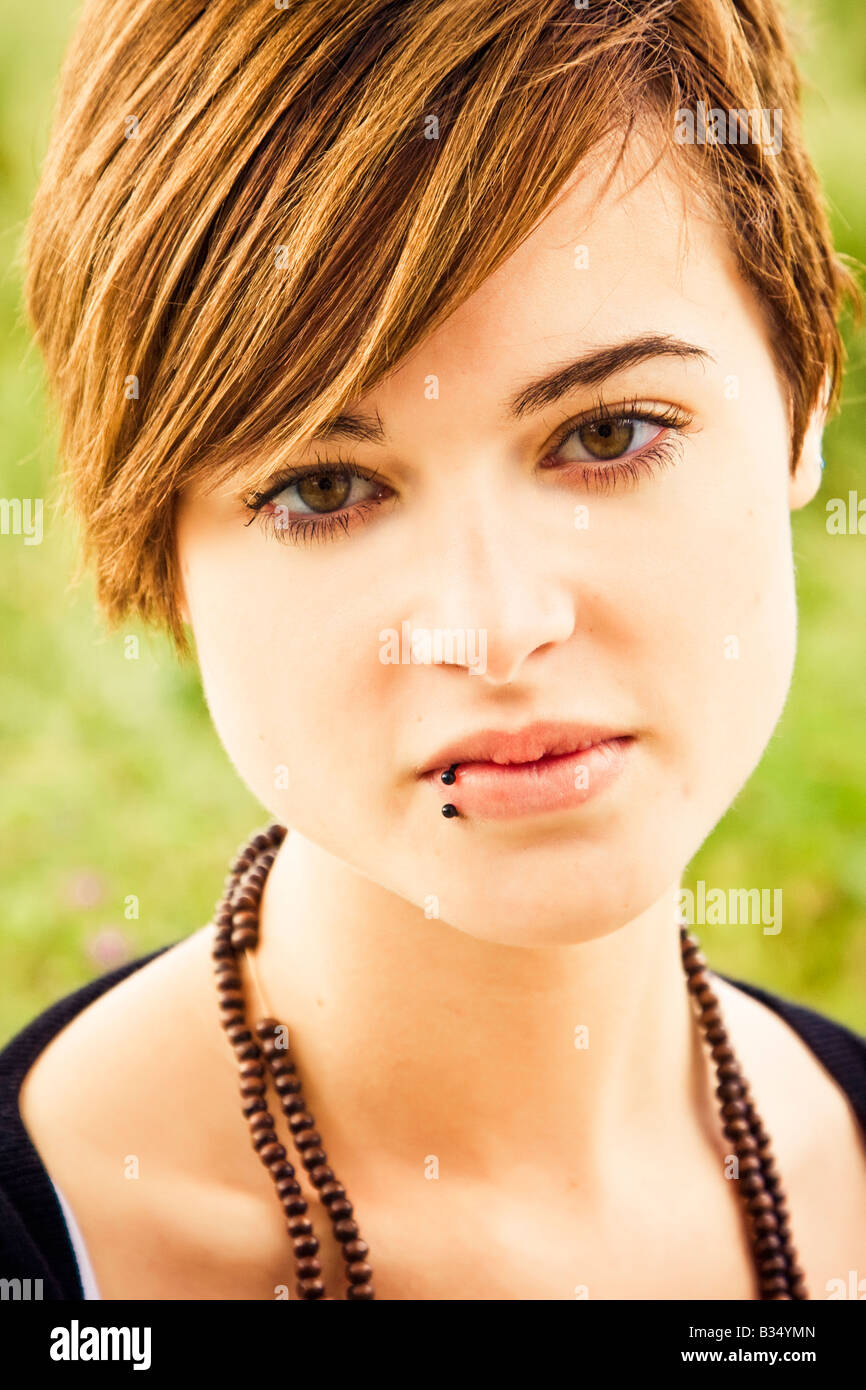 Beautiful pierced woman staring at camera Stock Photo - Alamy