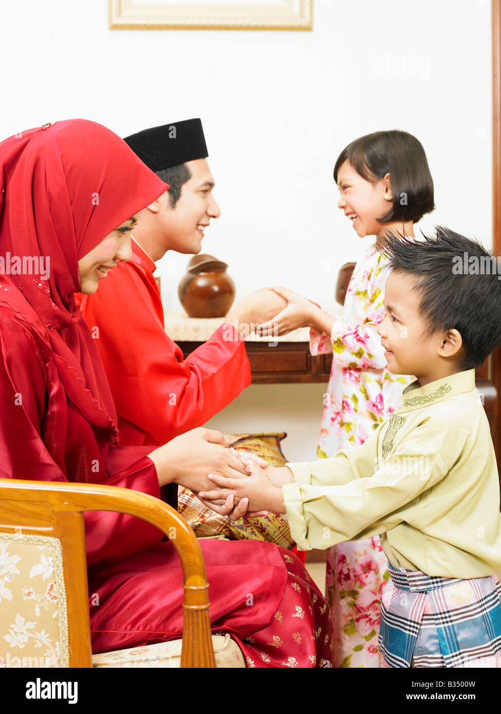 Family forgiving and blessing each other Stock Photo - Alamy