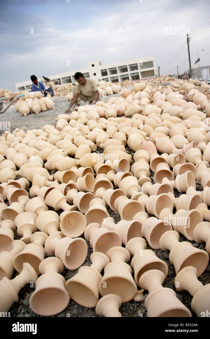 Bahrain potters leave their pots out to dry before firing Stock Photo ...