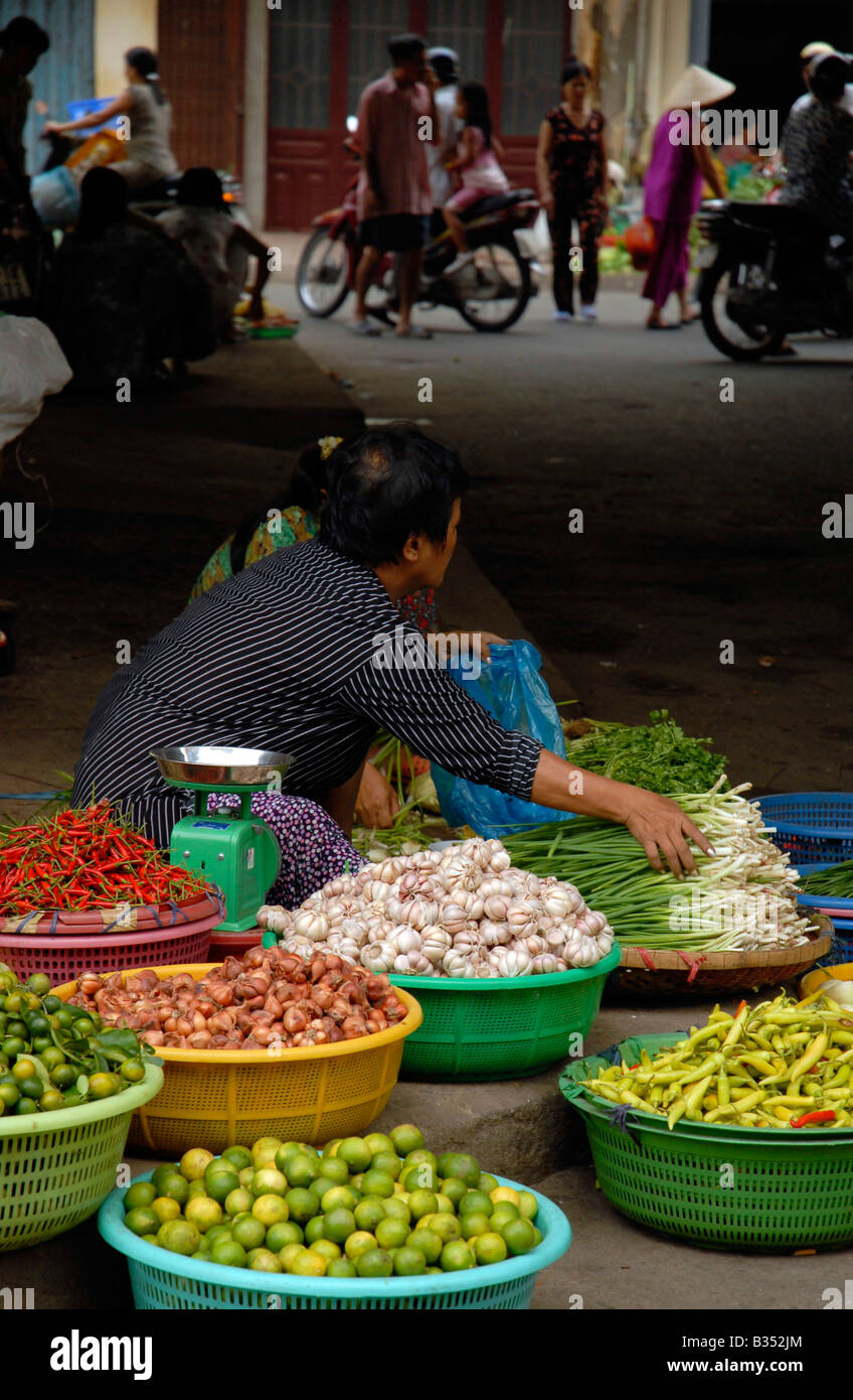 Women selling fresh fruit and vegetables in the Cao Moui Street market ...