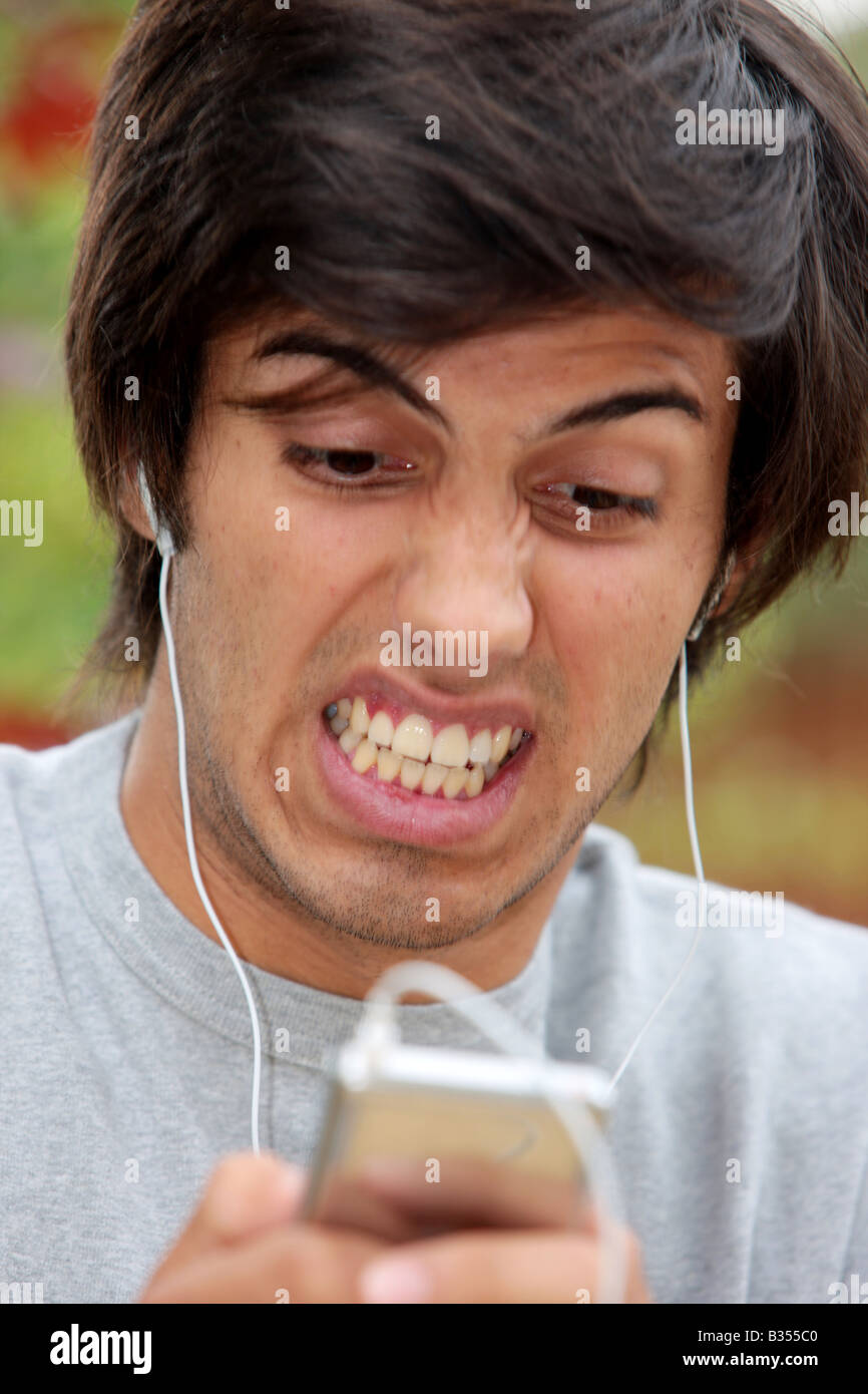 Angry Young Man Listening to Music Model Released Stock Photo - Alamy