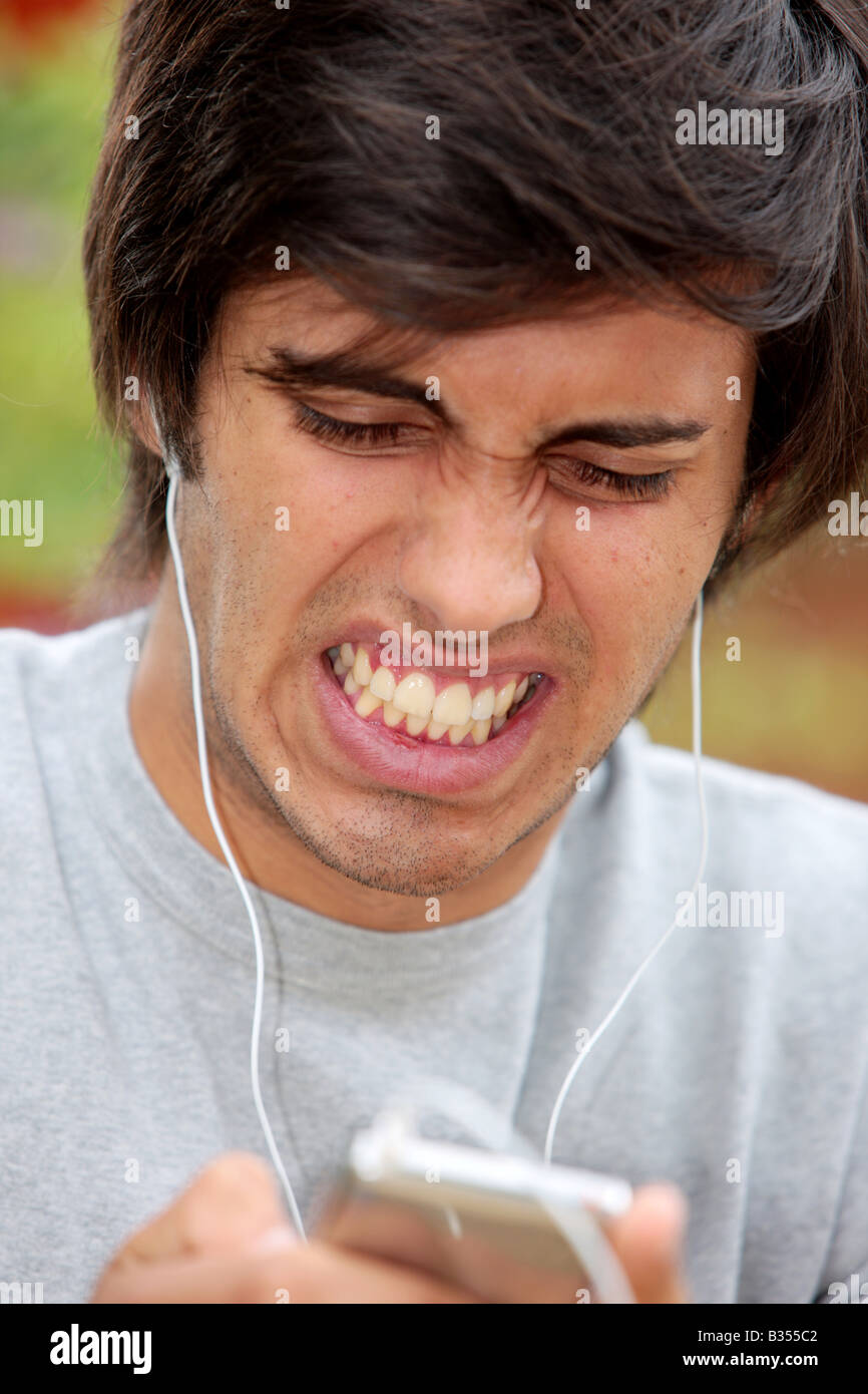 Angry Young Man Listening to Music Model Released Stock Photo - Alamy