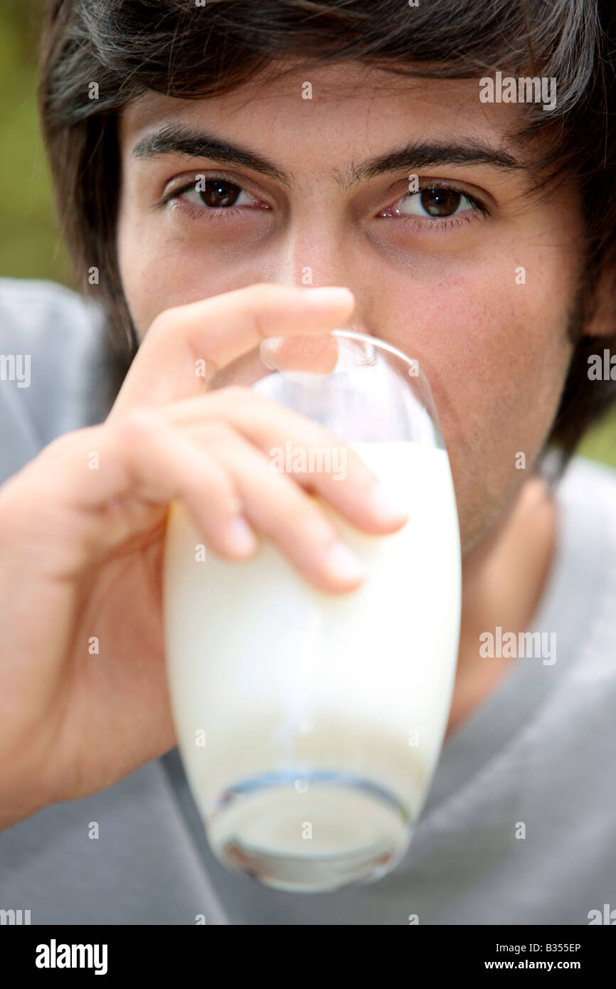 Young Man Drinking Milk Model Released Stock Photo - Alamy