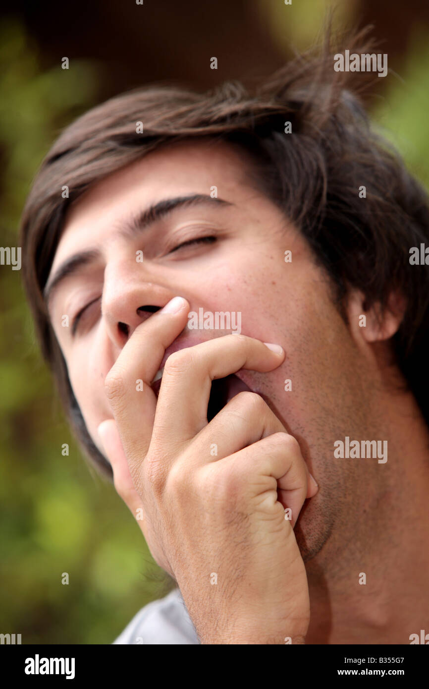 Young Man Yawning Model Released Stock Photo - Alamy